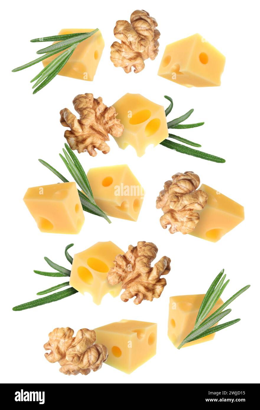 Cheese, walnuts and rosemary flying on white background Stock Photo - Alamy