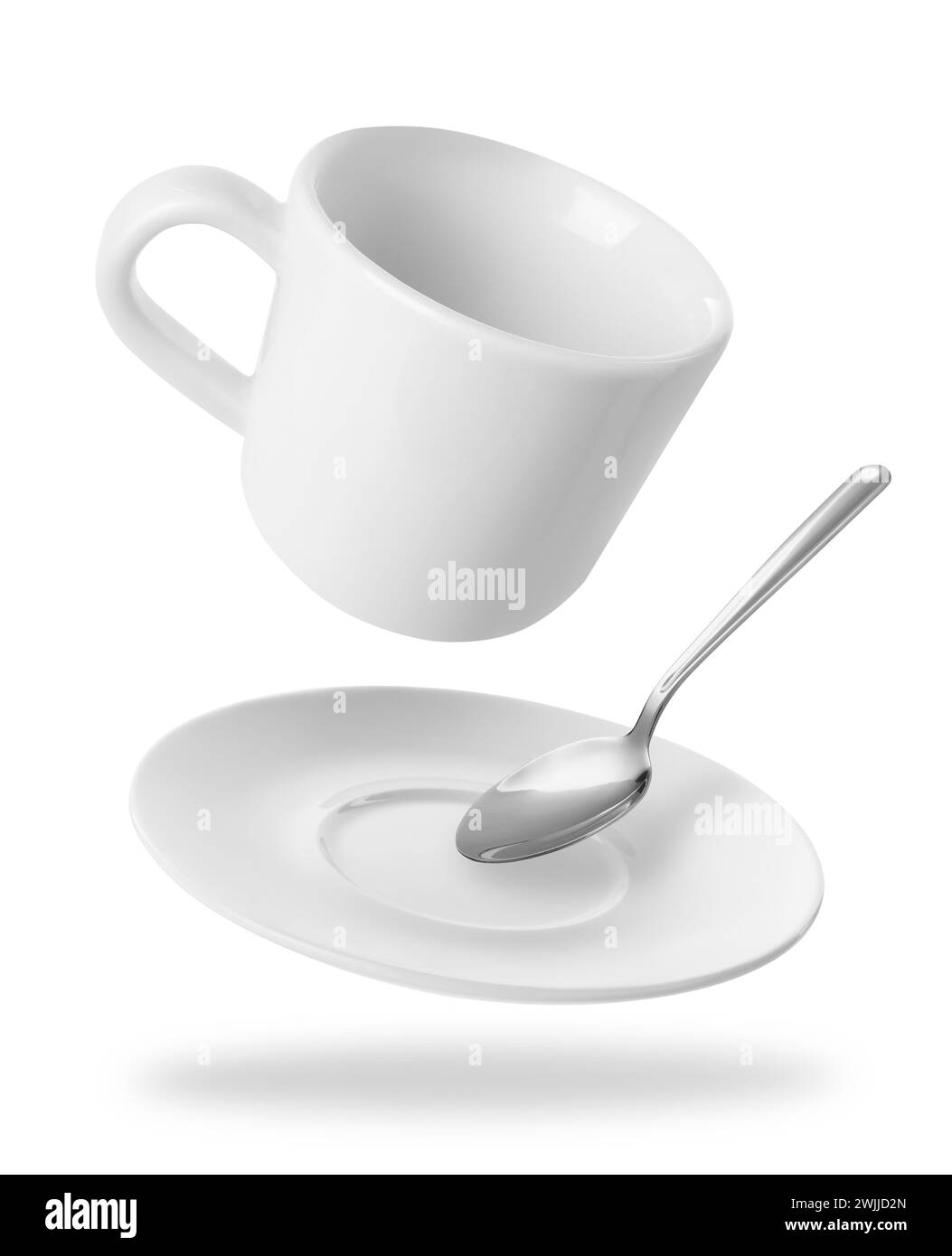 Spoon, cup and saucer falling on white background Stock Photo - Alamy