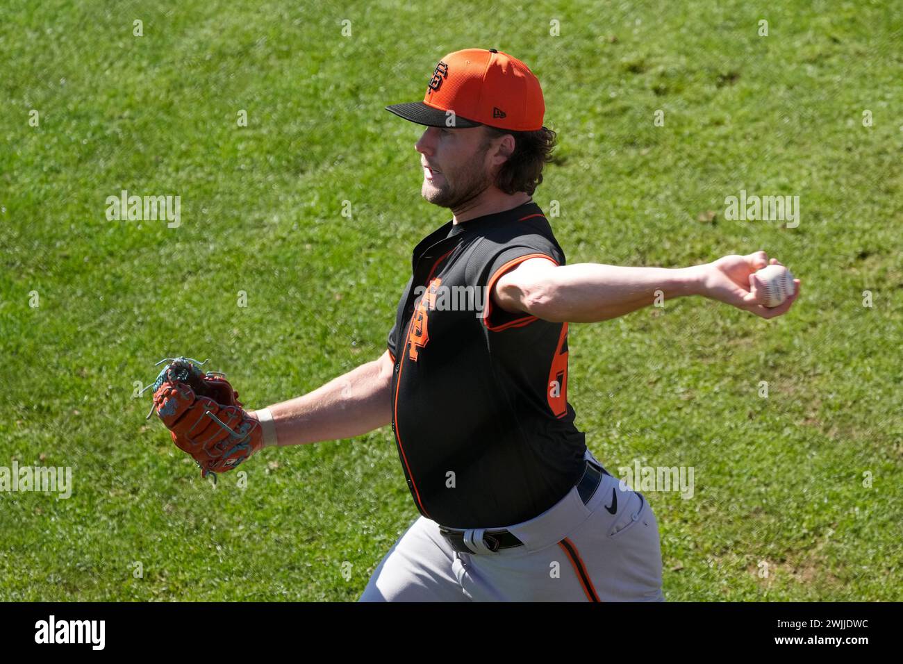 San Francisco Giants relief pitcher Erik Miller warms up during spring training baseball ...