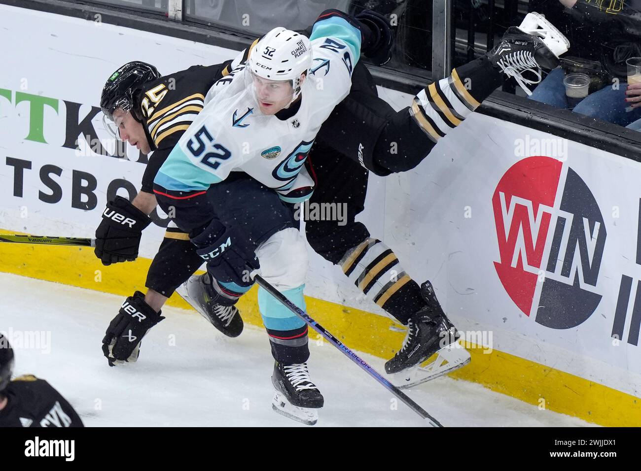 Seattle Kraken left wing Tye Kartye (52) and Boston Bruins defenseman ...