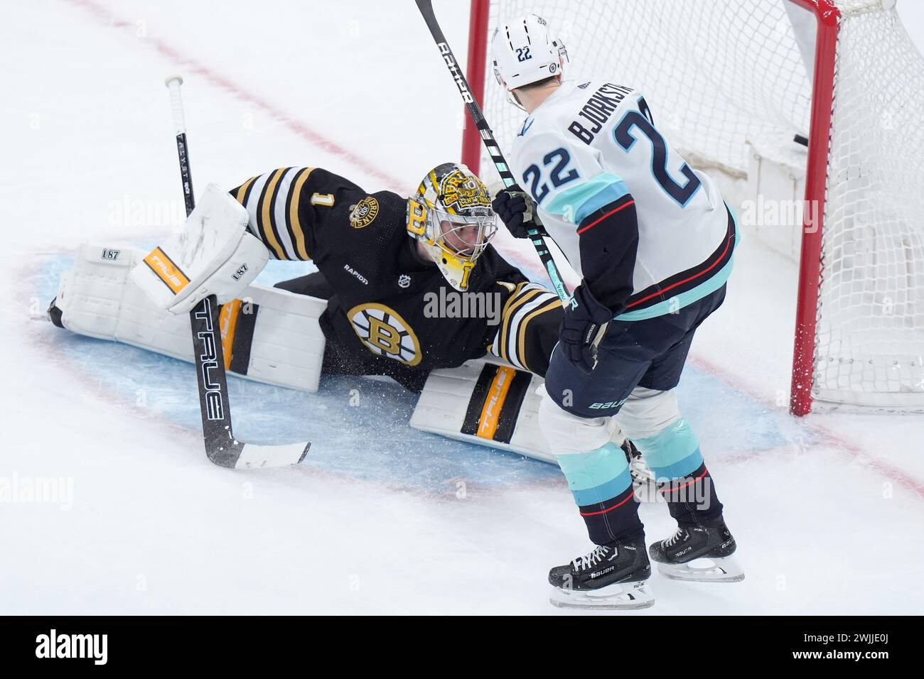 Boston Bruins goaltender Jeremy Swayman (1) is unable to stop the puck ...