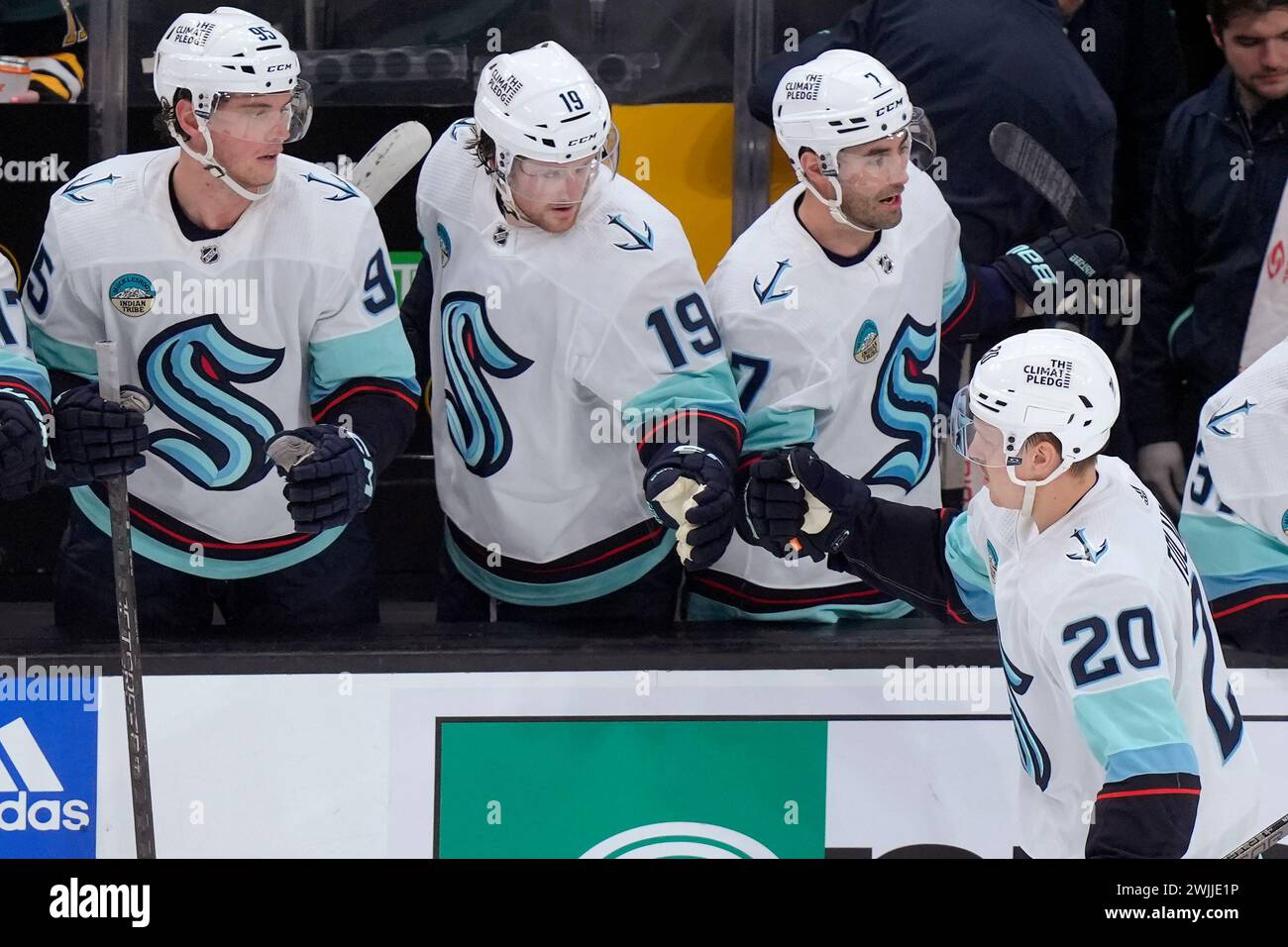 Seattle Kraken right wing Eeli Tolvanen (20) is congratulated for his ...