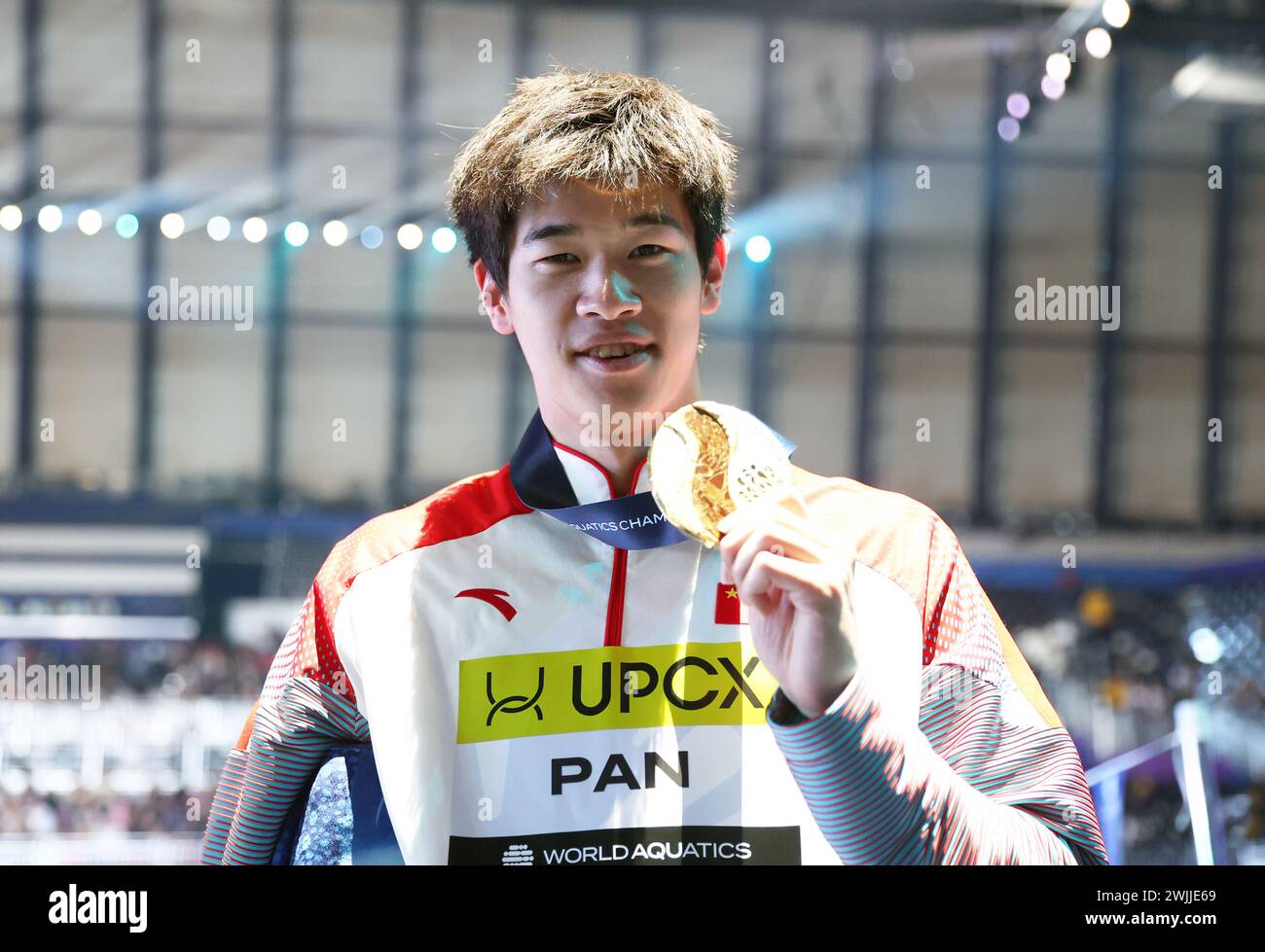 Doha, Qatar. 15th Feb, 2024. Pan Zhanle of China poses with the medal ...