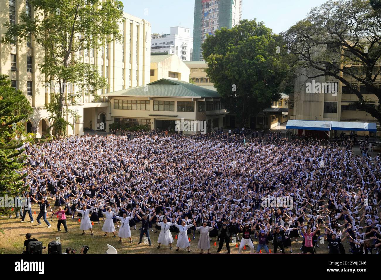 Students from the Catholic-run St. Scholastica's College flash the ...