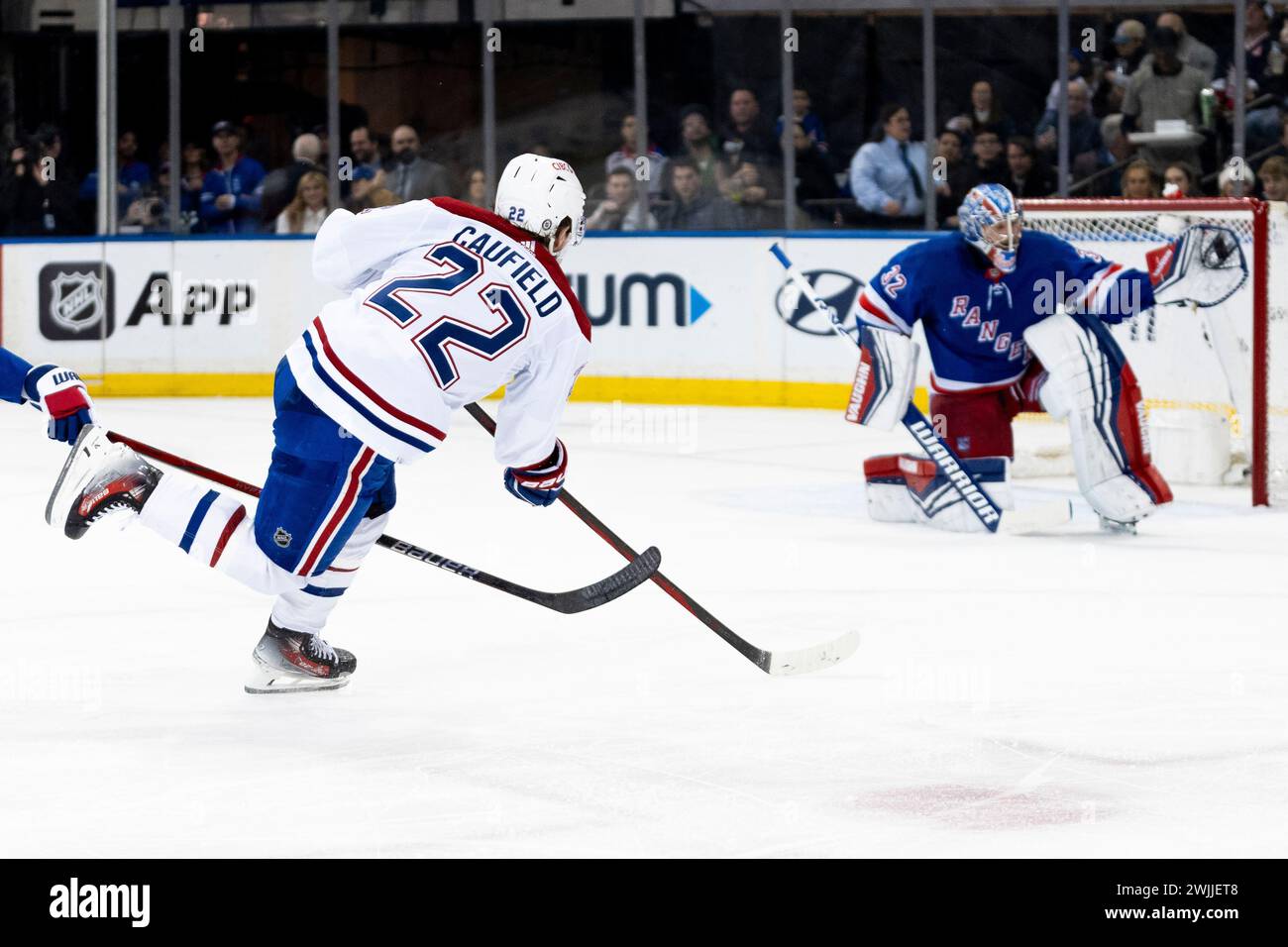 New York Rangers goaltender Jonathan Quick, right, saves a shot by ...