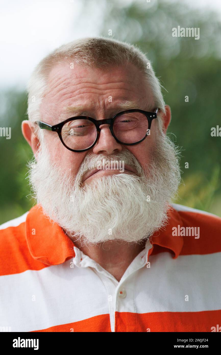 Portrait from crying male senior being unwell Stock Photo - Alamy