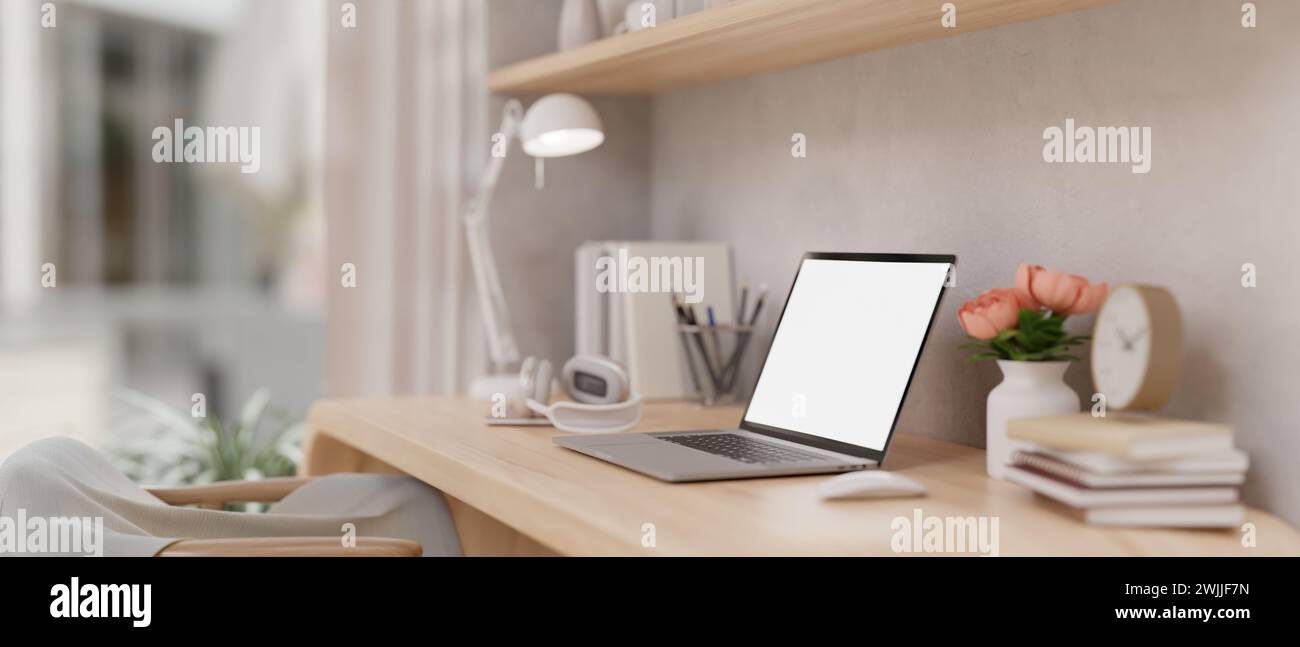 Side view of a white-screen laptop computer mockup and accessories on a ...