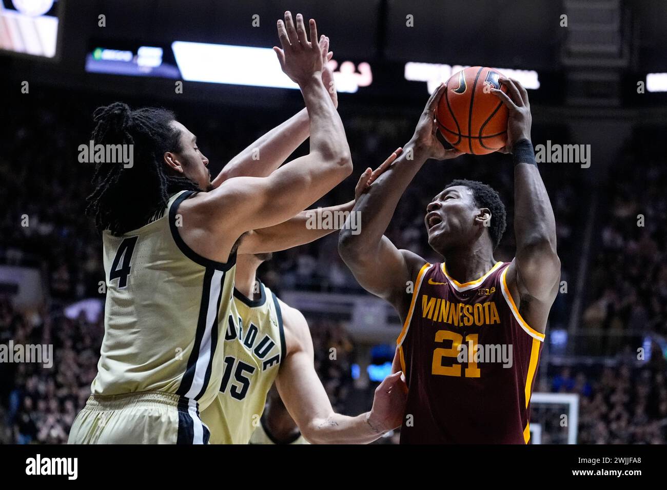 Minnesota forward Pharrel Payne (21) looks to shoots over Purdue ...