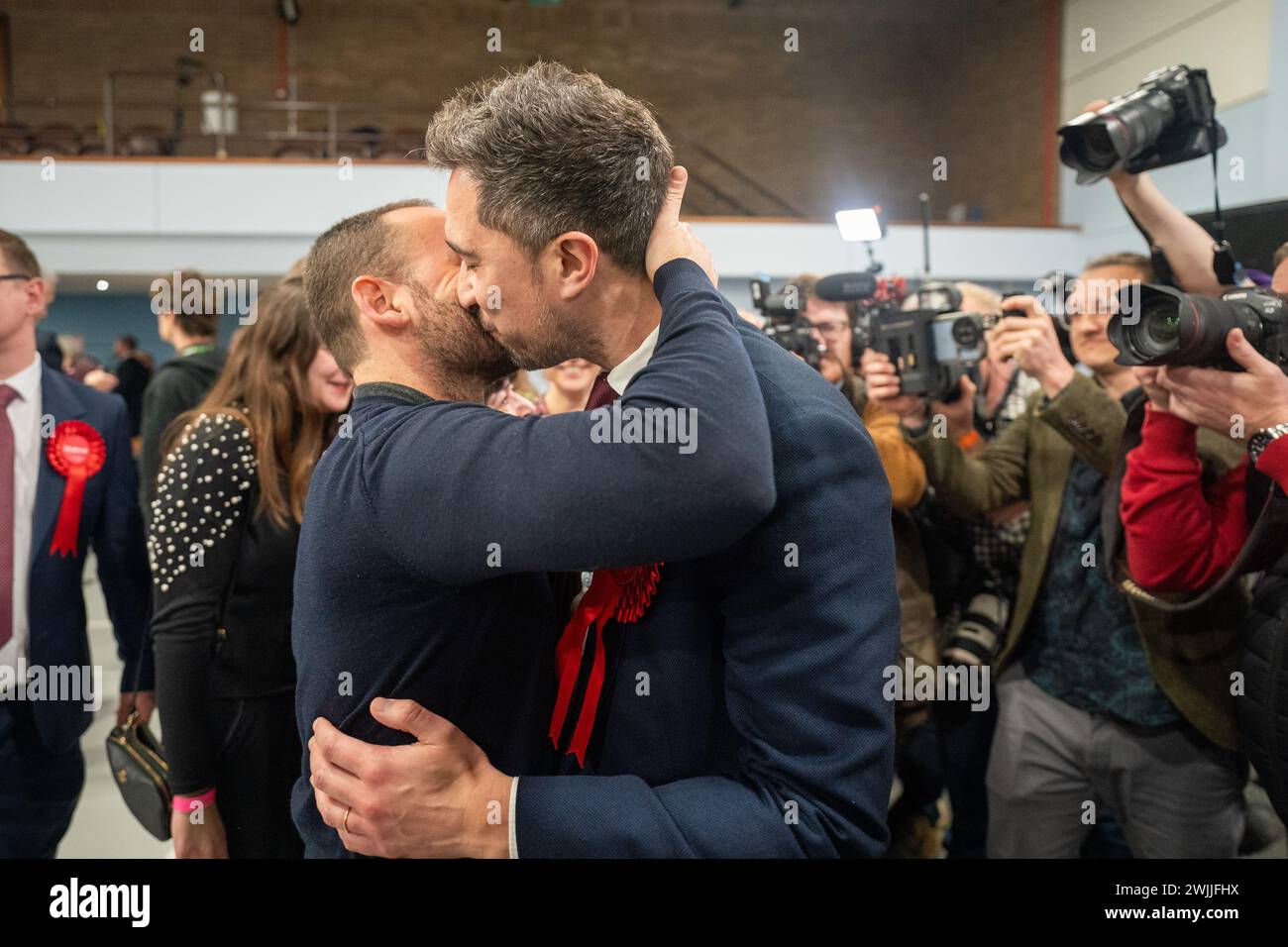 Labour candidate Damien Egan shares a kiss with his husband Yossi ...