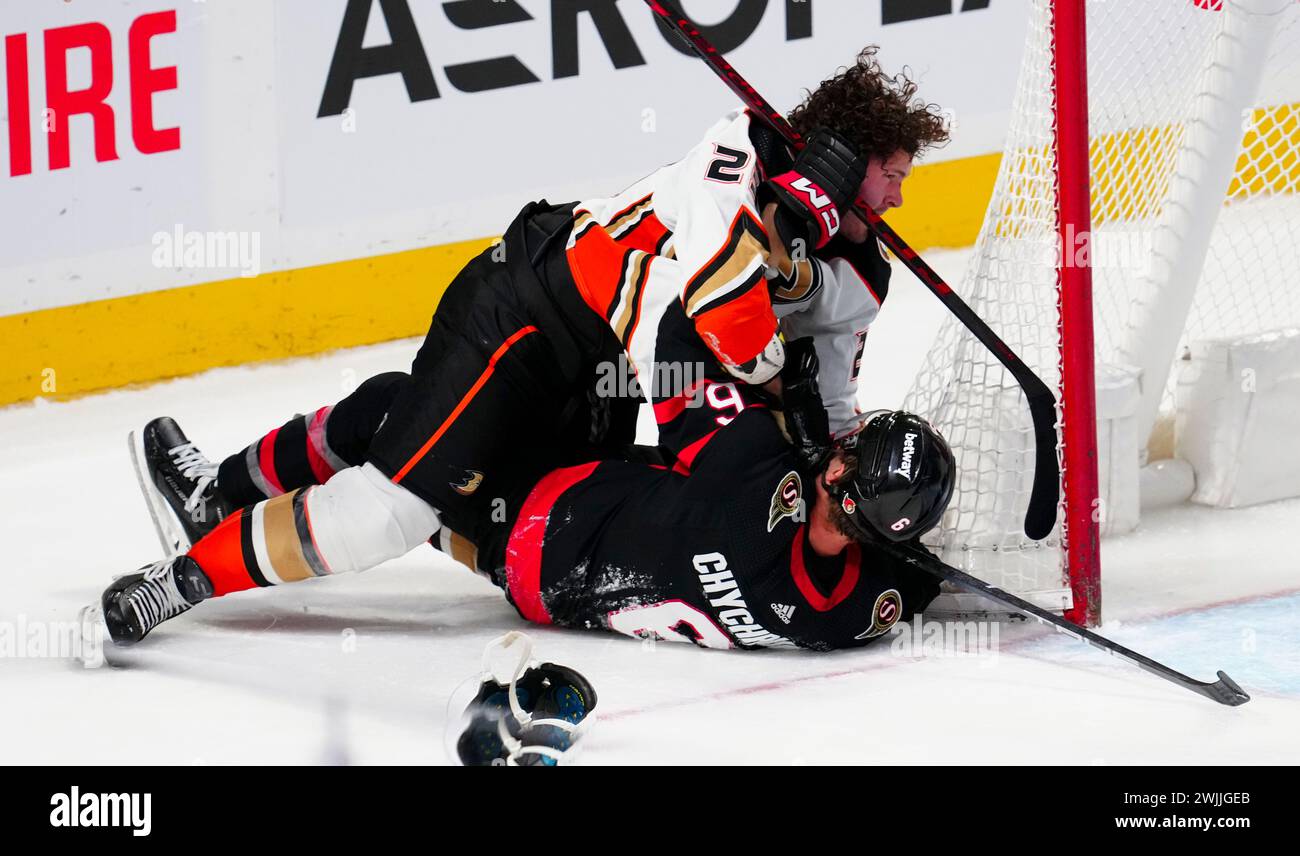 Anaheim Ducks center Mason McTavish, top, pushes Ottawa Senators ...