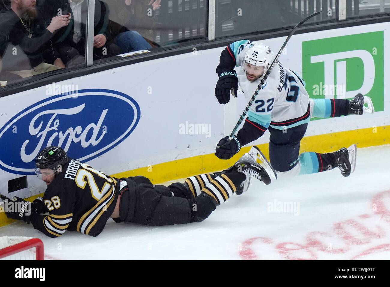Boston Bruins defenseman Derek Forbort (28) and Seattle Kraken right ...