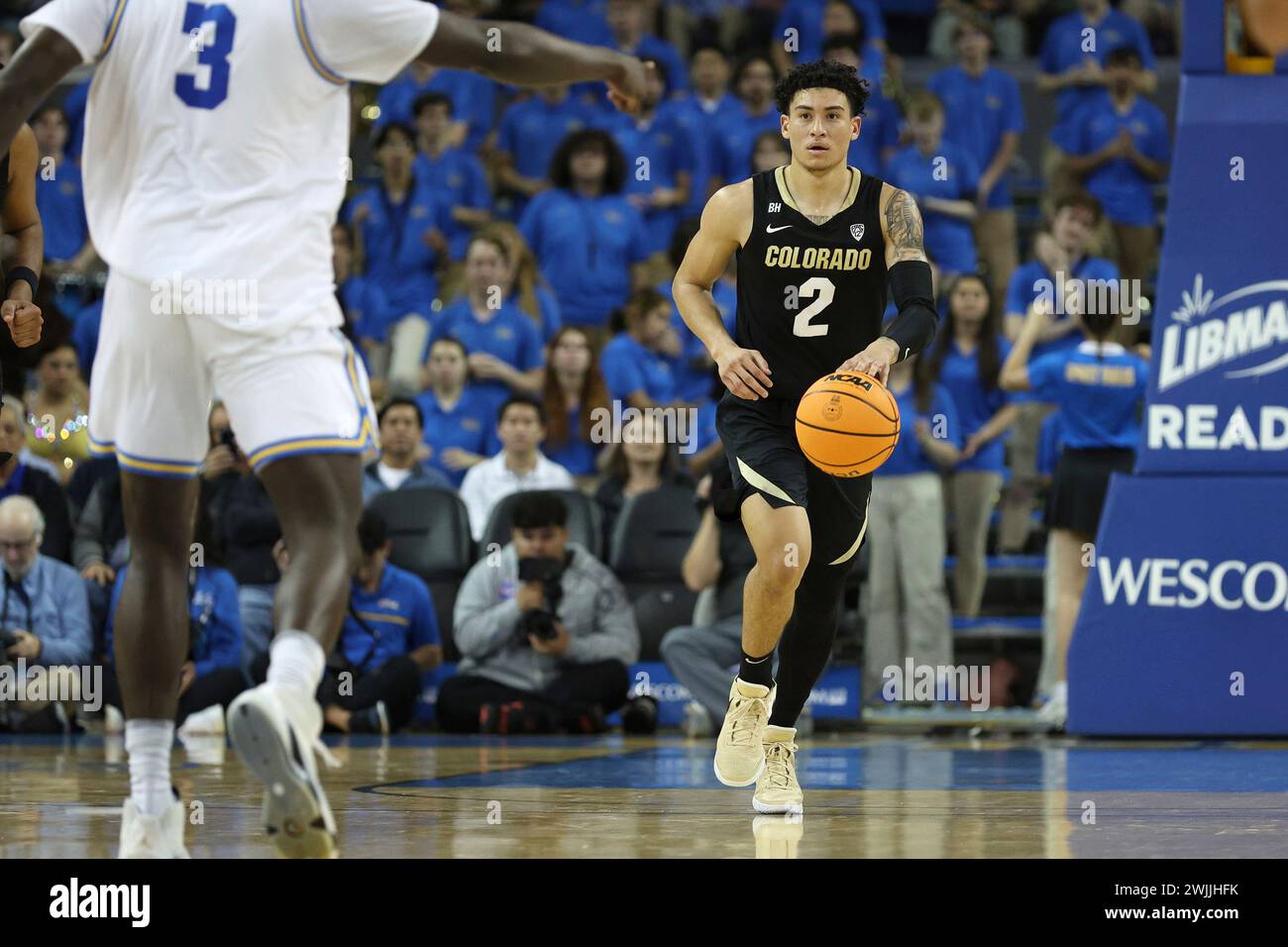 Colorado guard KJ Simpson (2) brings the ball downcourt against UCLA ...