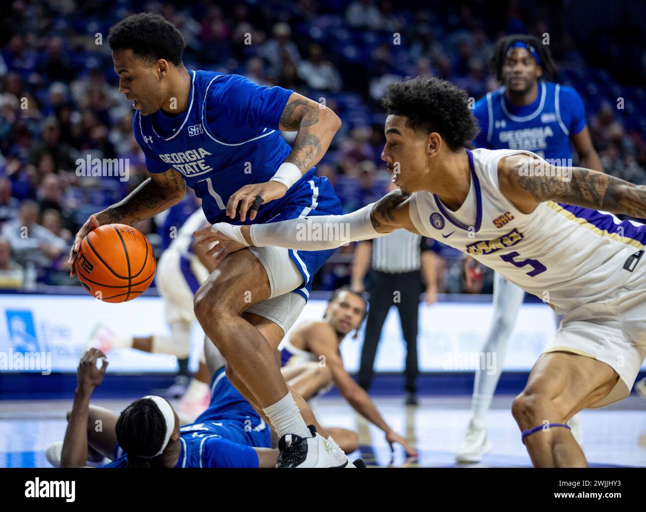 James Madison guard Terrence Edwards Jr. (5) tries to steal the ball ...