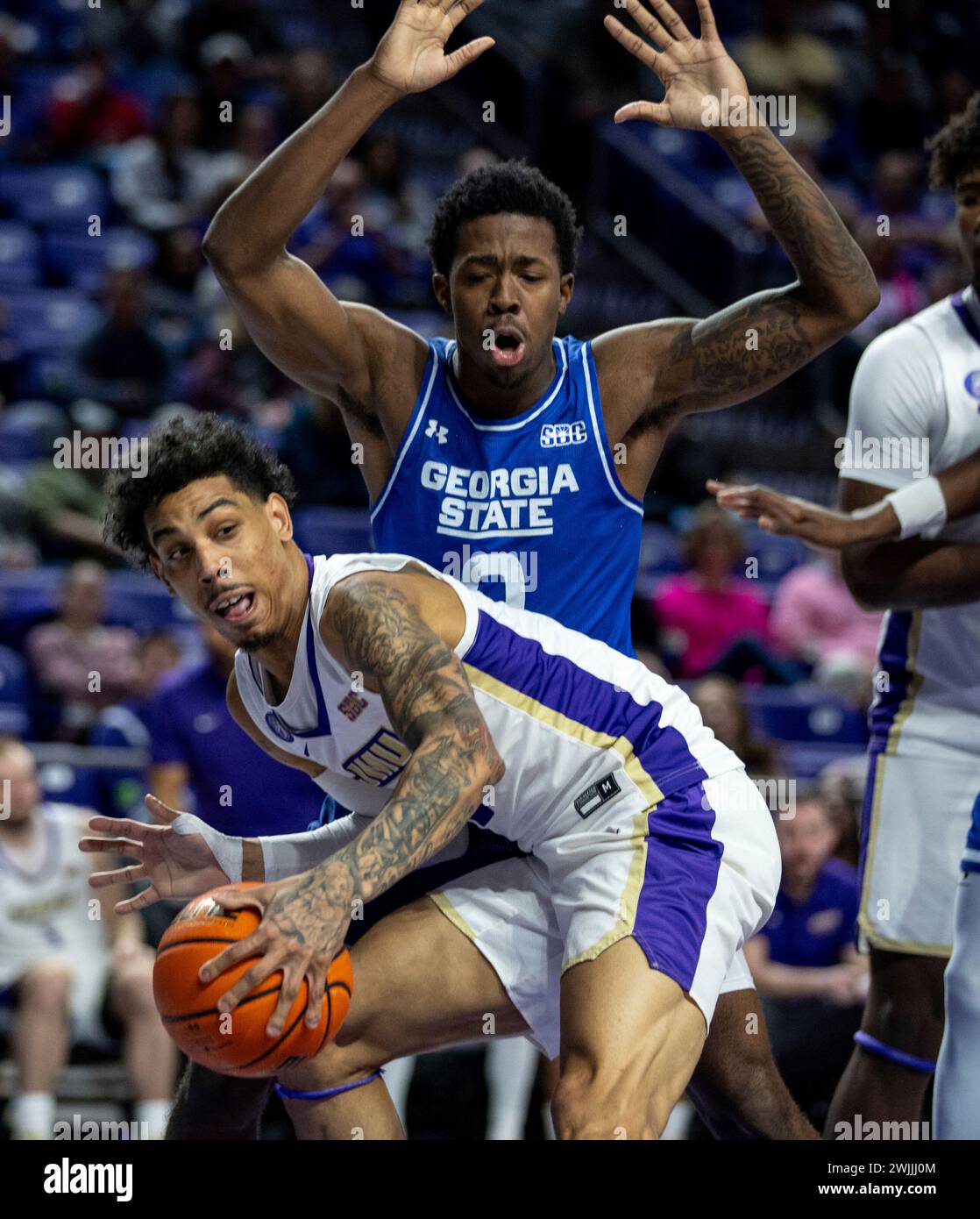 James Madison guard Terrence Edwards Jr. (5) looks for an escape route ...