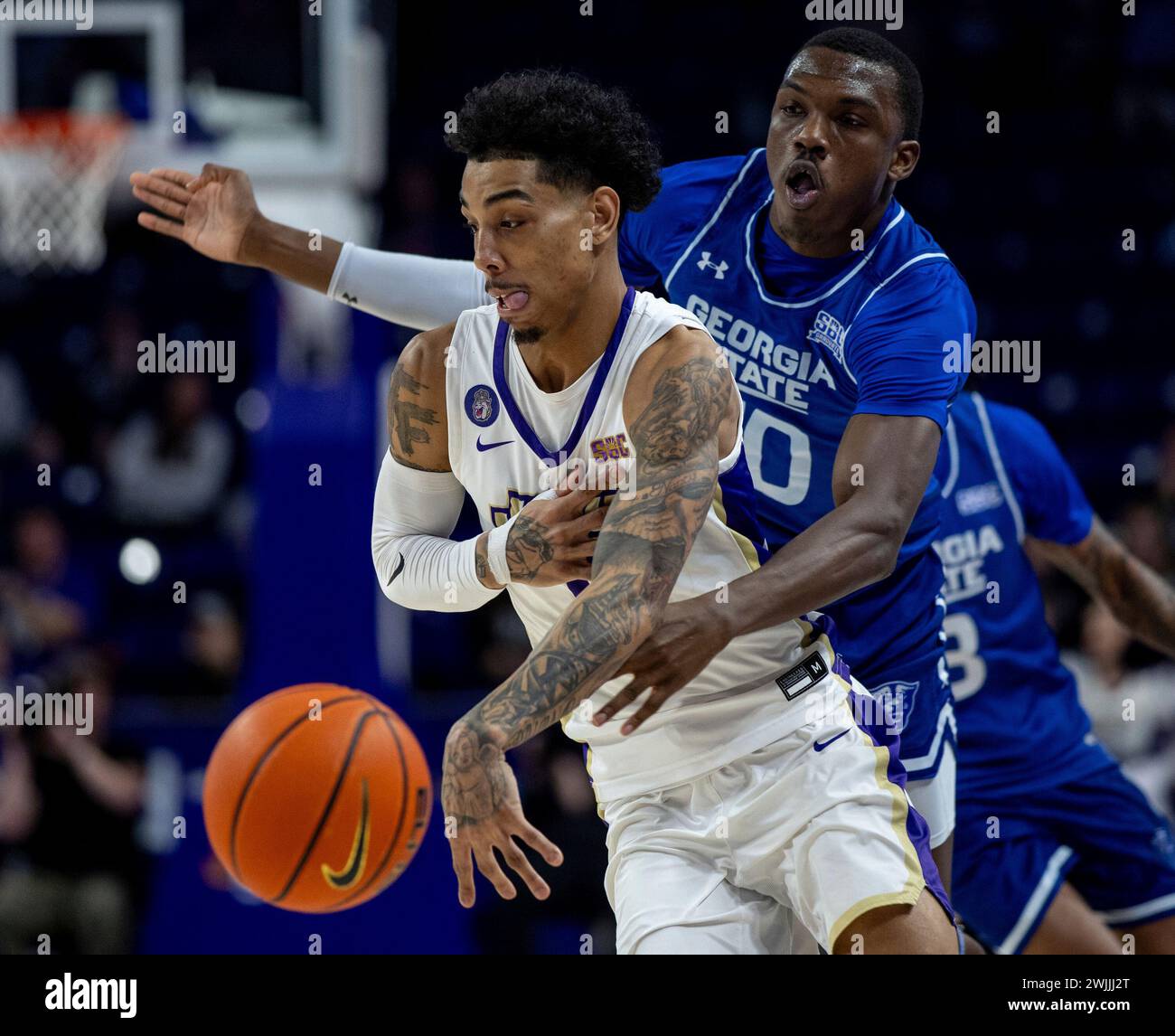 James Madison guard Terrence Edwards Jr., left, is defended by Georgia ...