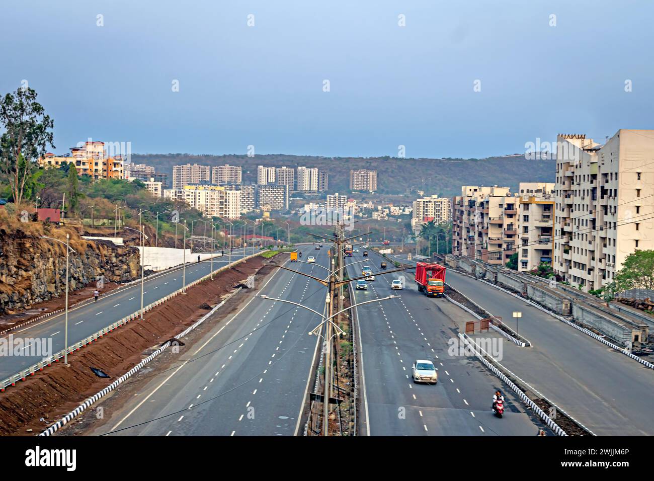 Traffic flowing on highway with nice blue sky background Stock Photo ...