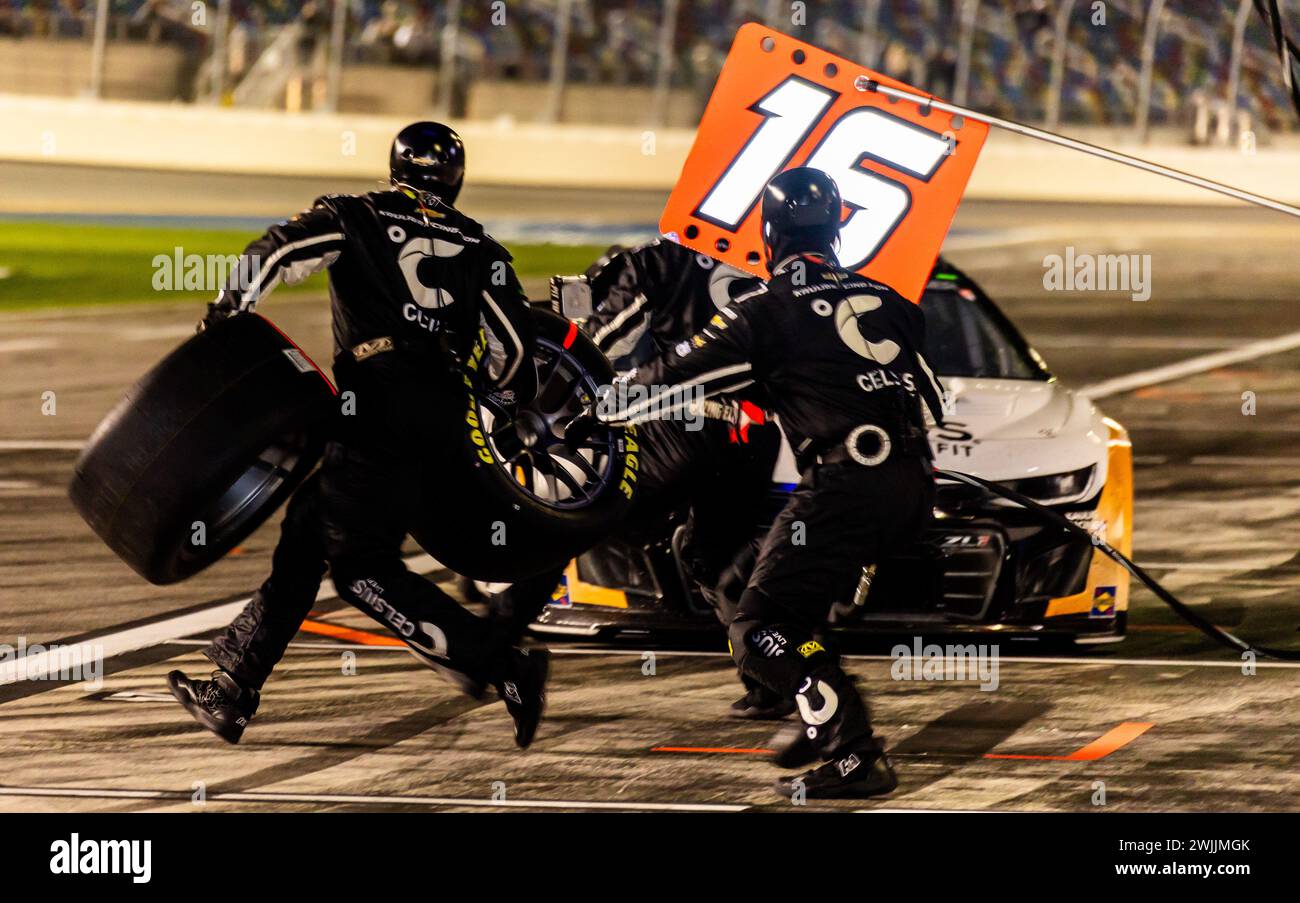 The crew of AJ Almendinger go to work during a pit stop late in the ...