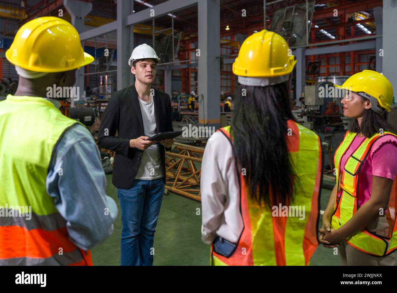 Warehouse safety meeting, people with hardhat. Industrial teamwork ...