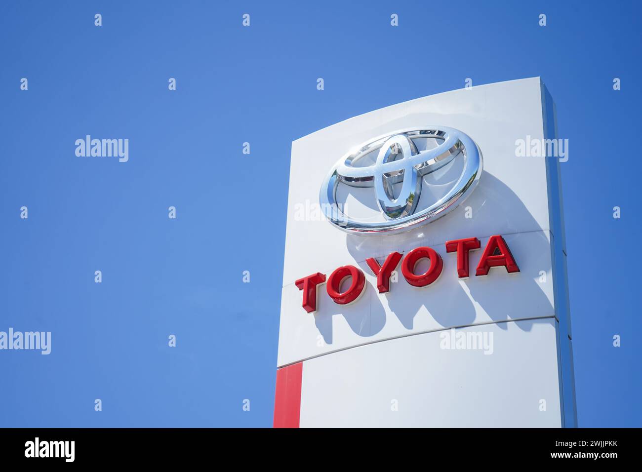 Toyota logo outside a car showroom Stock Photo - Alamy
