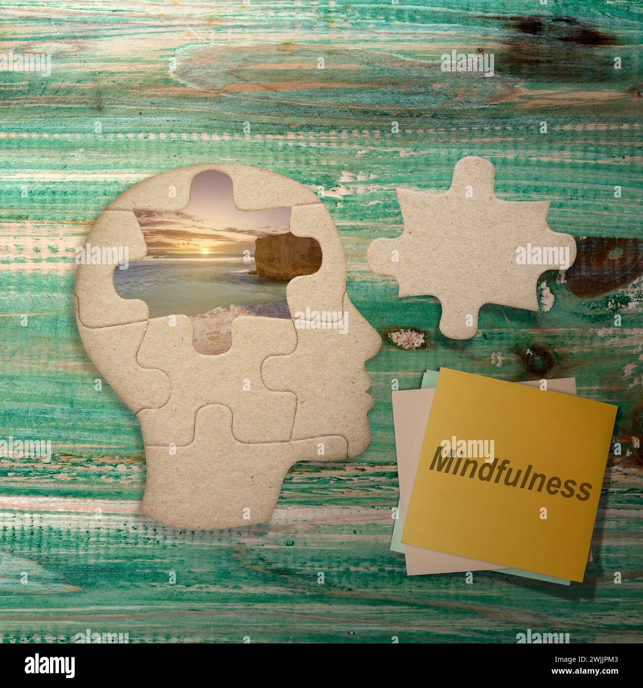 Stack of paper with mindfulness text and missing piece of the head ...
