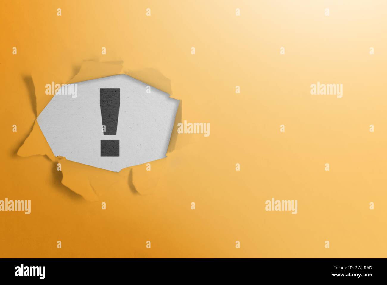 Ripped paper with an exclamation mark symbol with a white background ...