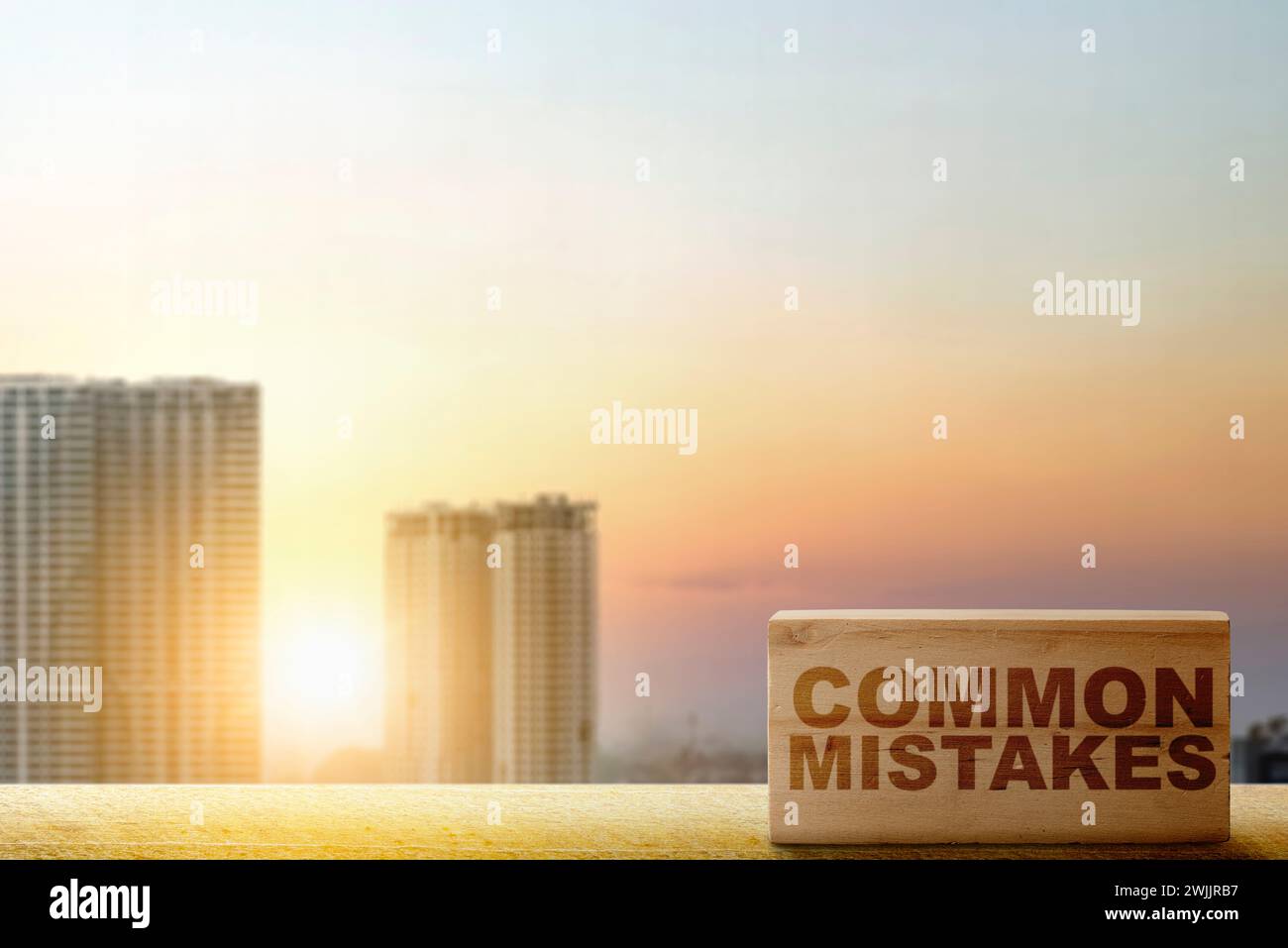 Wooden block with 'common mistake' text on the table. Mistake concept ...
