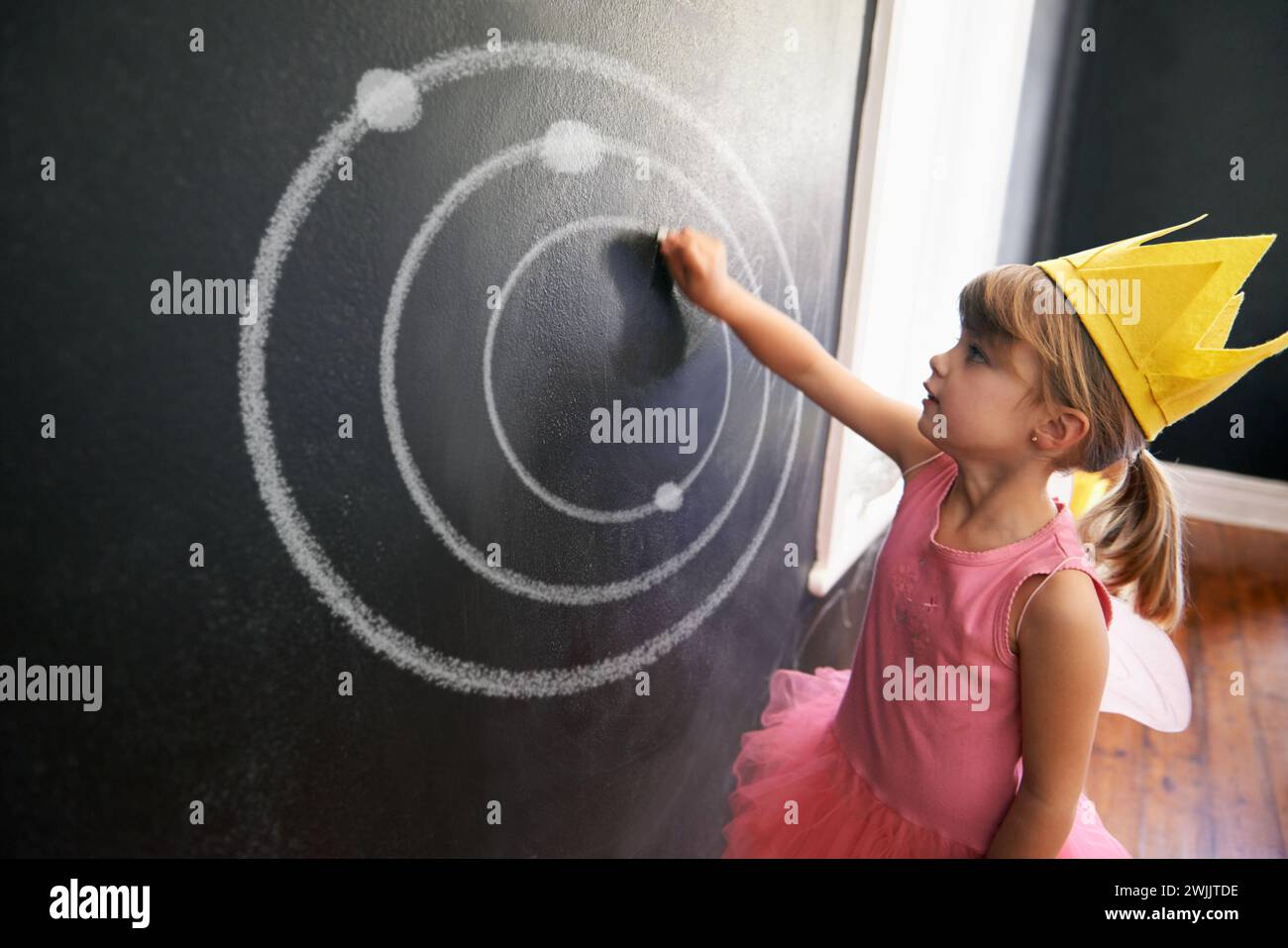 Child, board and drawing solar system for education with chalk in ...