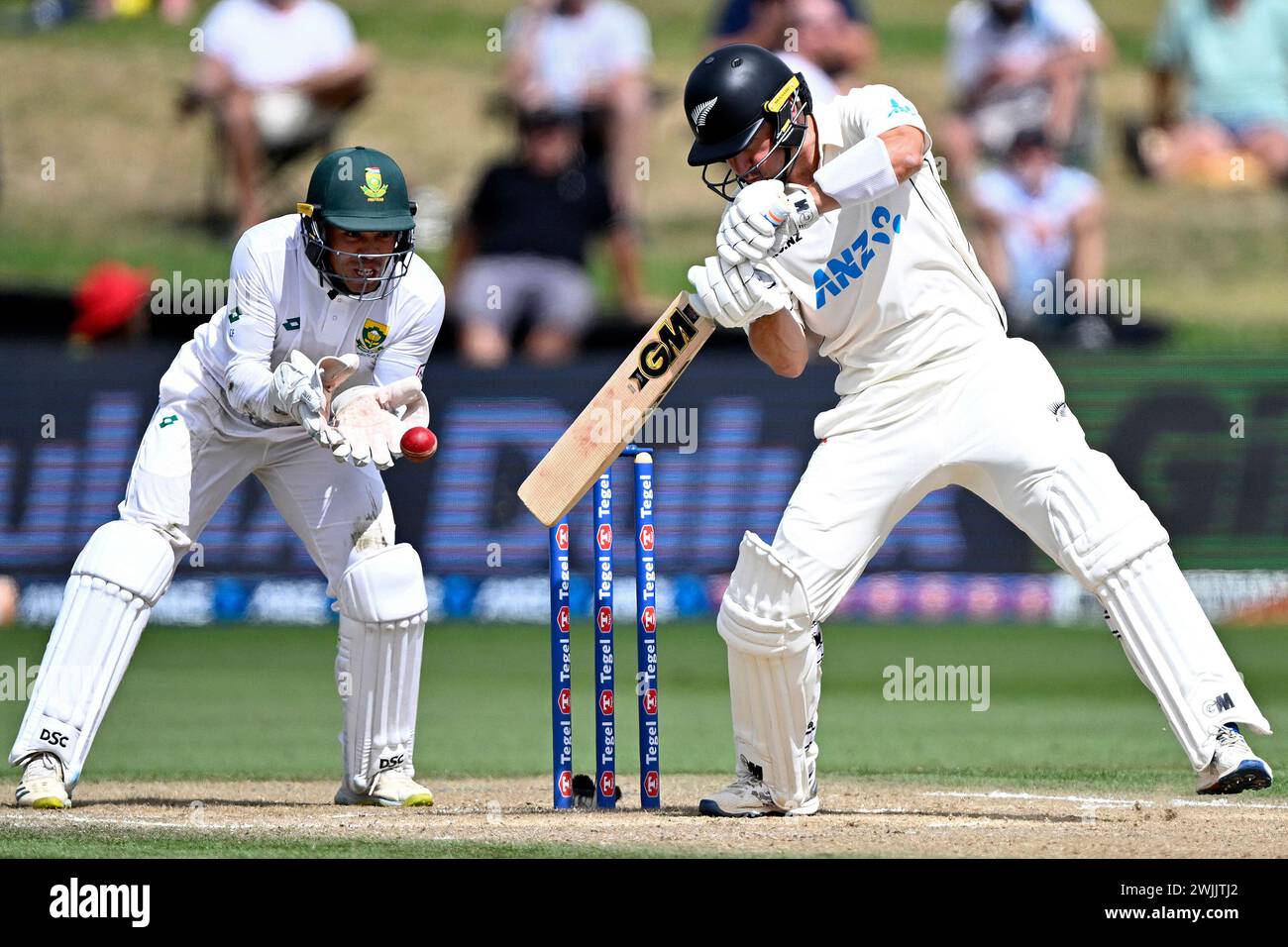 New Zealand's New Zealand's Will Young, right, plays a shot in front of ...