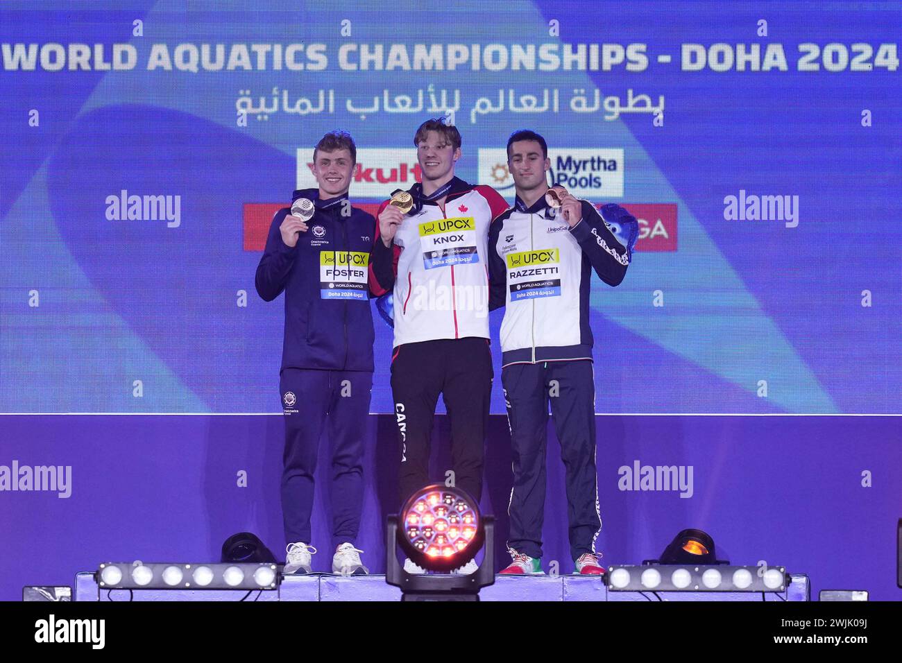 Doha, Qatar. 15th Feb, 2024. Gold medalist Finlay Knox (C) of Canada ...