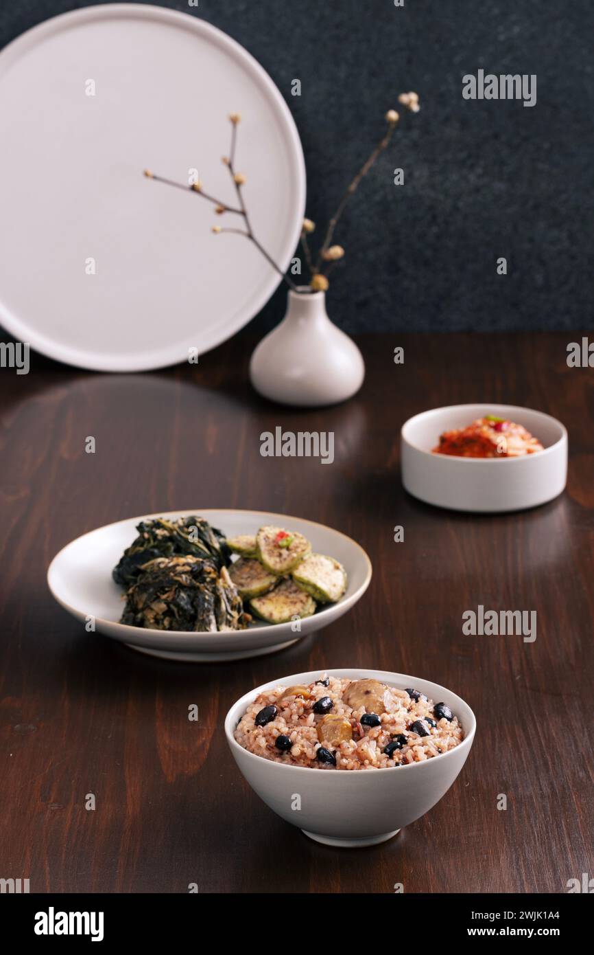 a table of dried greens and five grain rice Stock Photo - Alamy
