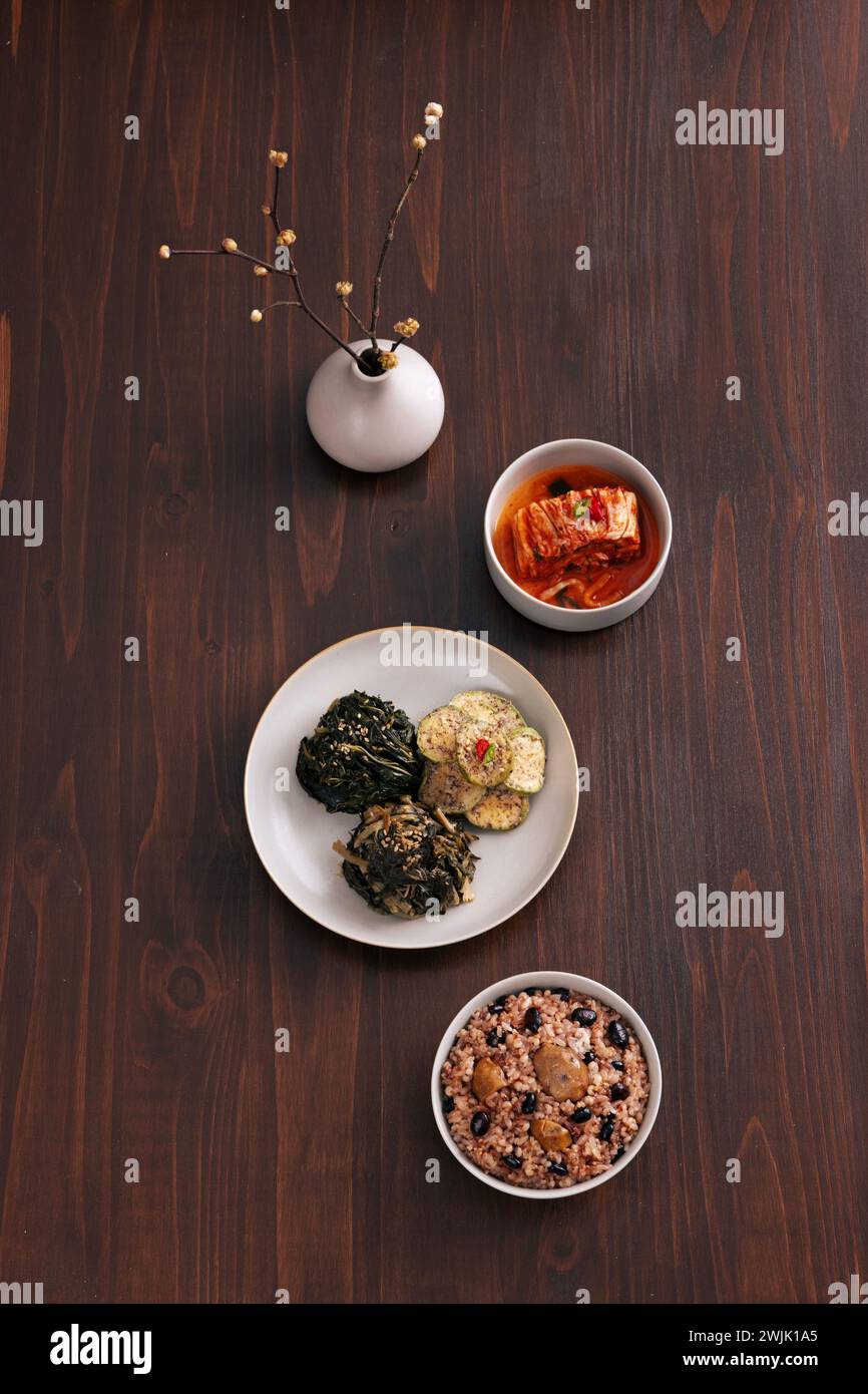 a table of dried greens and five grain rice Stock Photo - Alamy