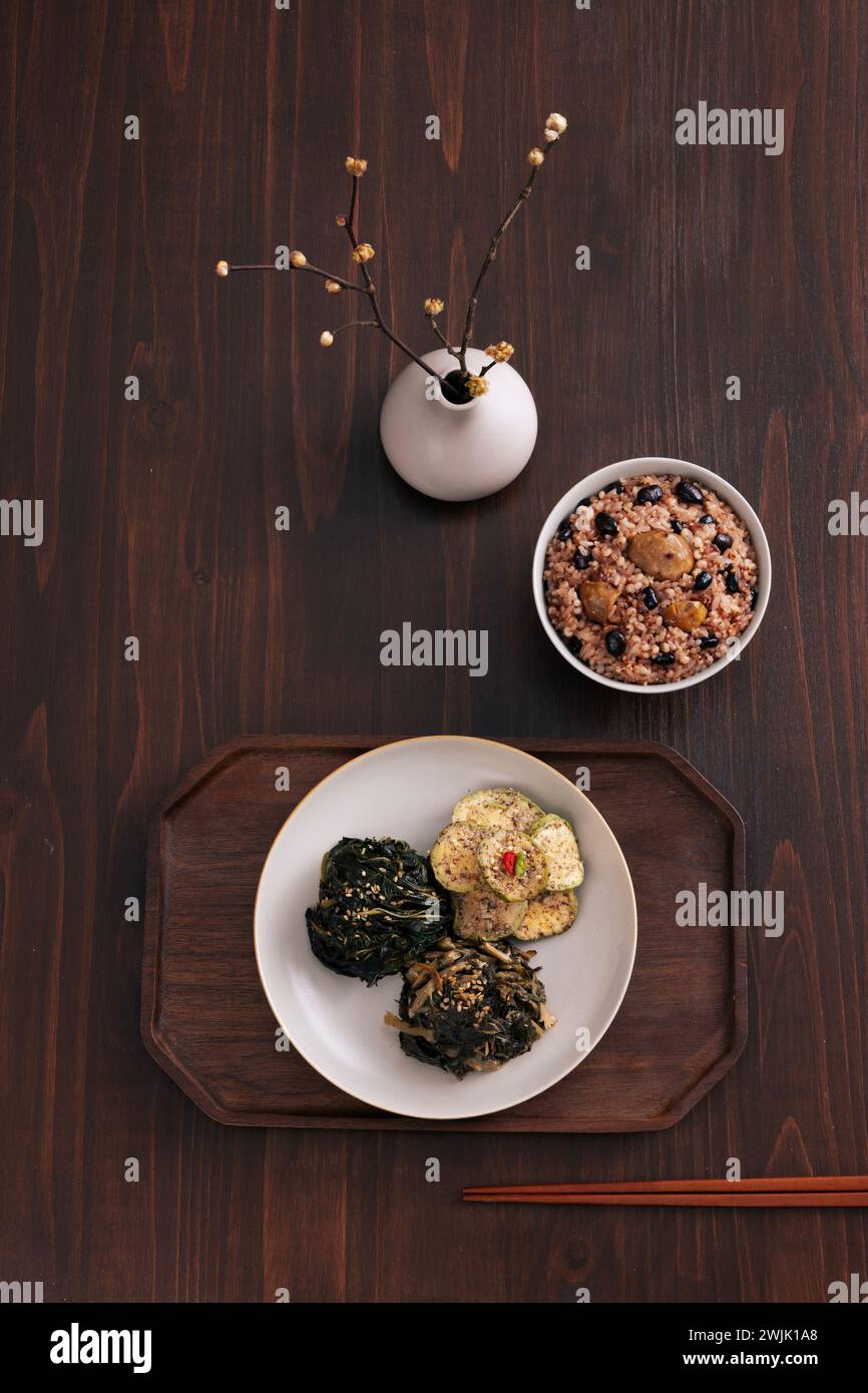 a table of dried greens and five grain rice Stock Photo - Alamy