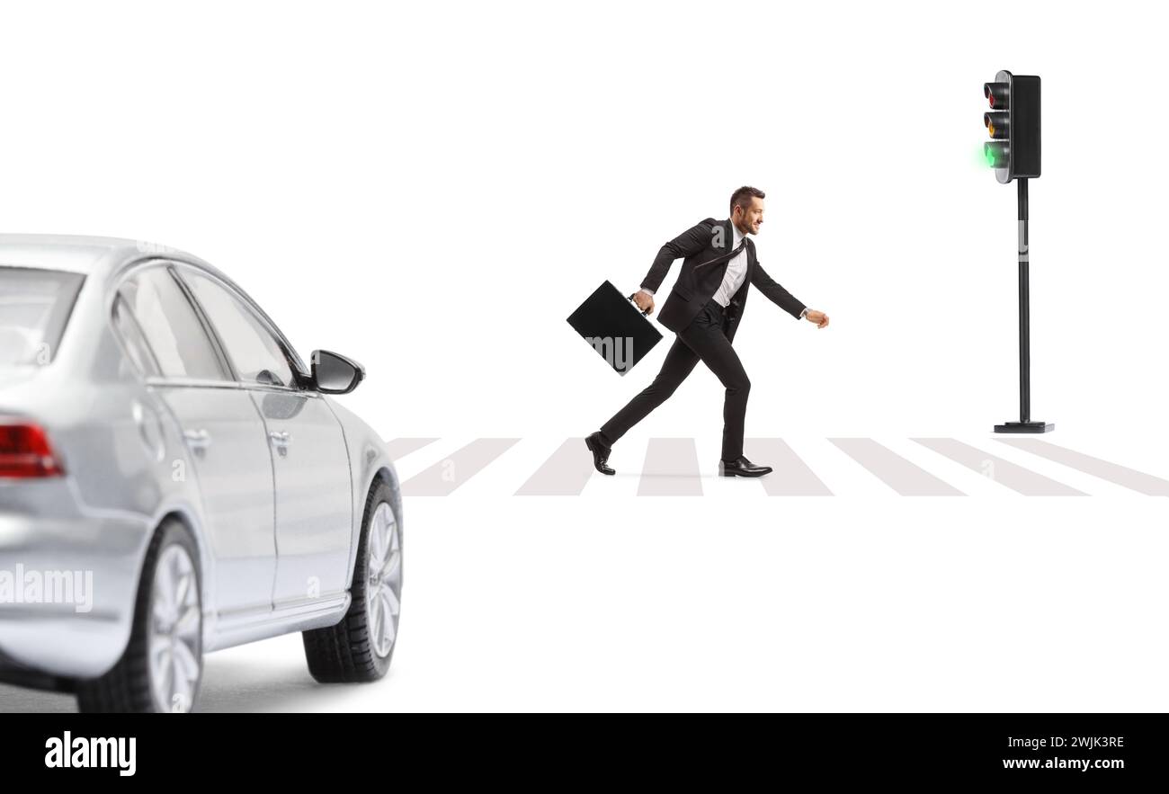 Full length profile shot of a businessman with a briefcase running in ...