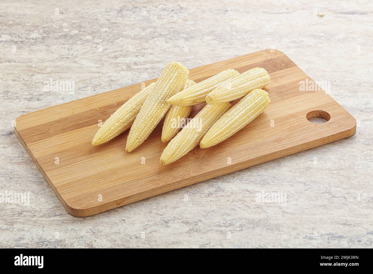 Raw natural organic baby corn heap Stock Photo - Alamy