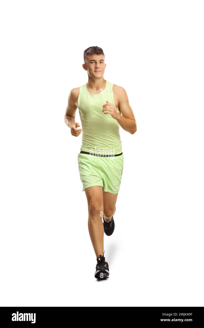 Teenage guy in sportswear jogging towards camera isolated on white ...