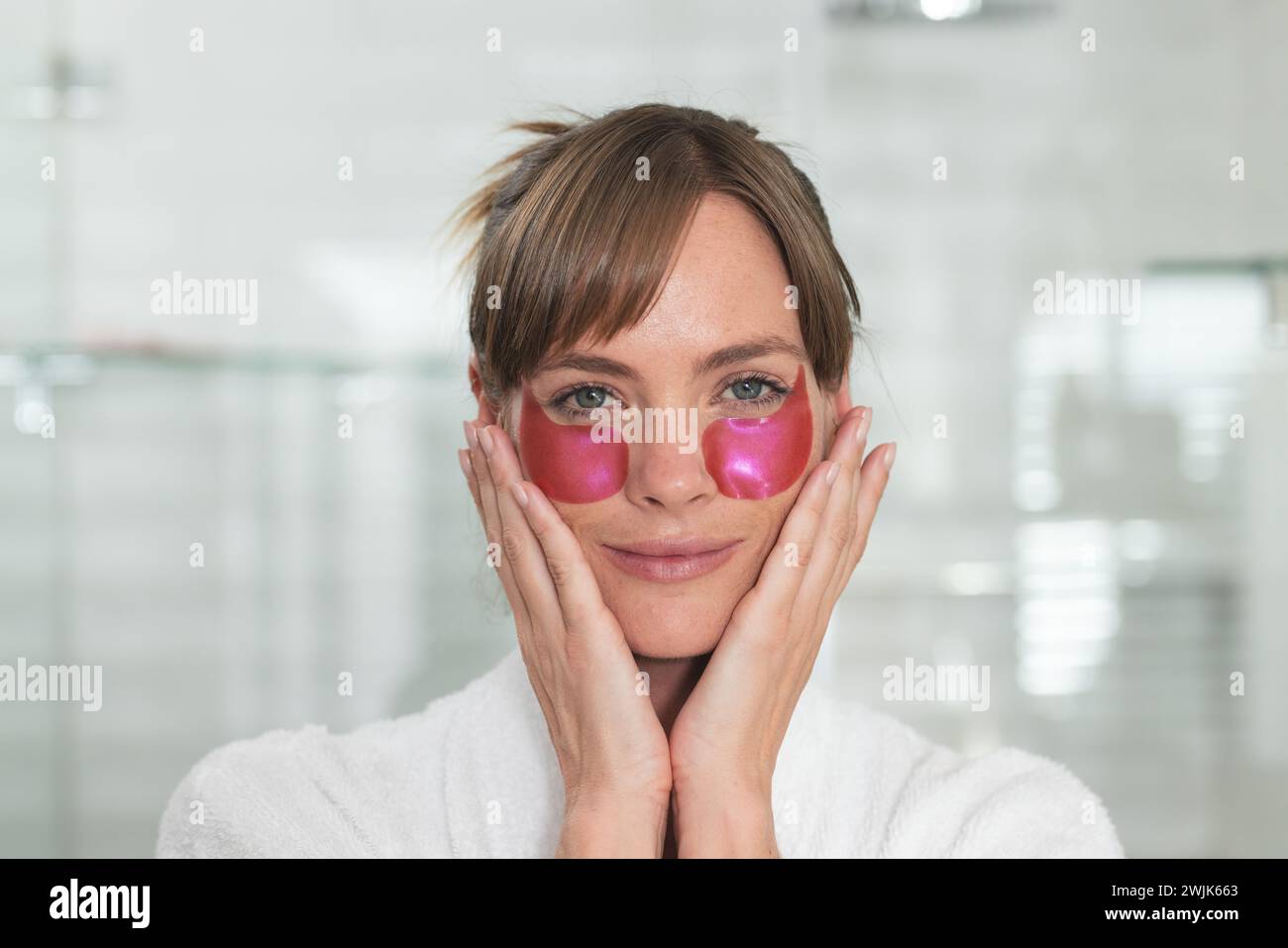 Caucasian woman enjoys a spa day at home wearing a pink eye mask Stock ...