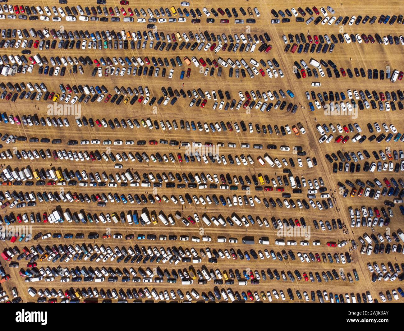 Top-down aerial photo showcasing a vast parking lot filled with ...