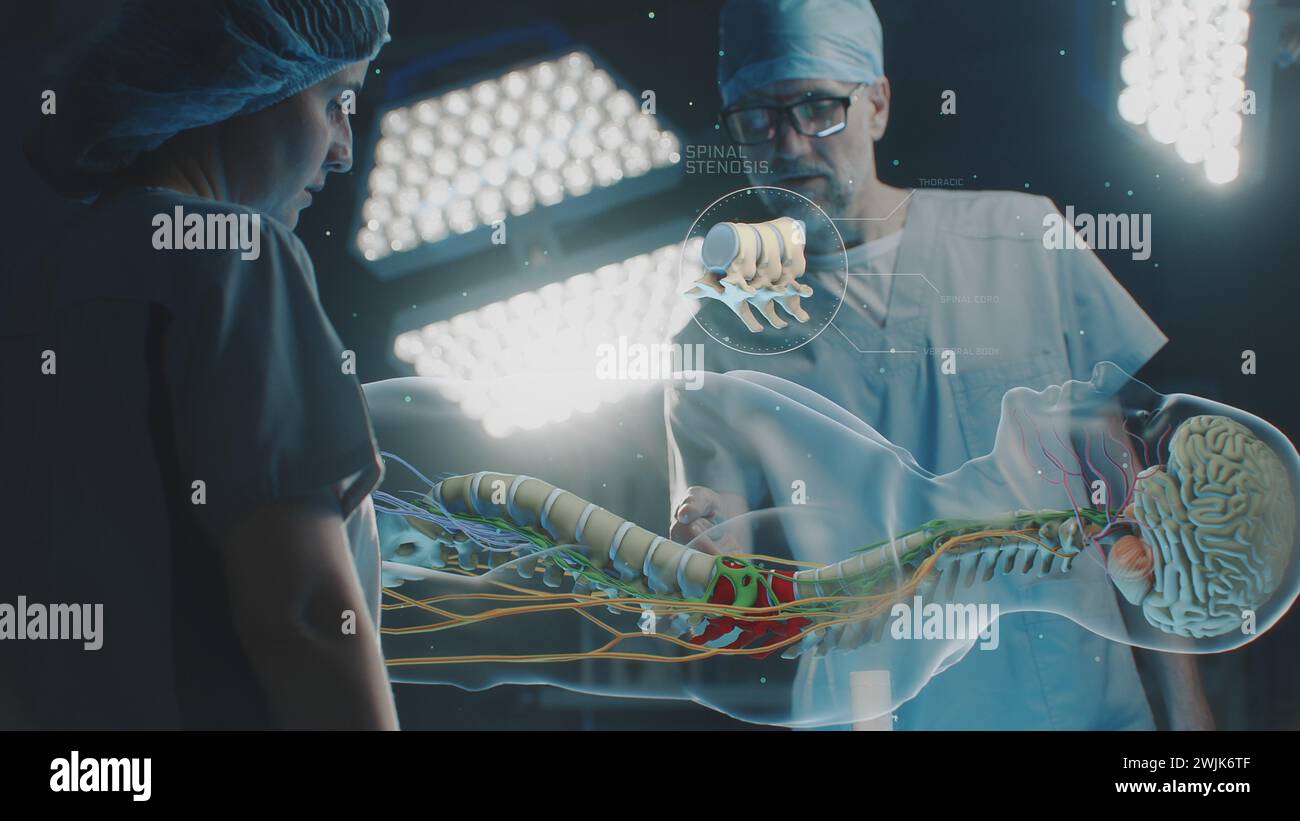 Male and female surgeons work in modern operating room using futuristic ...