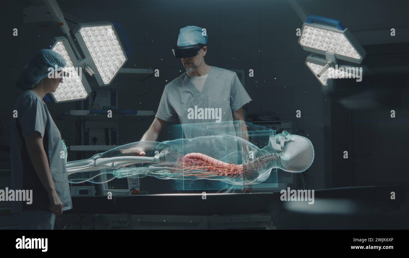 Male and female surgeons in AR headsets perform surgery in operating ...