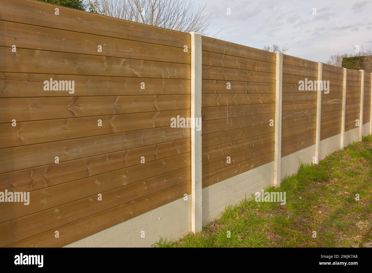 wall wooden fence with pillar concrete structure street wood barrier ...