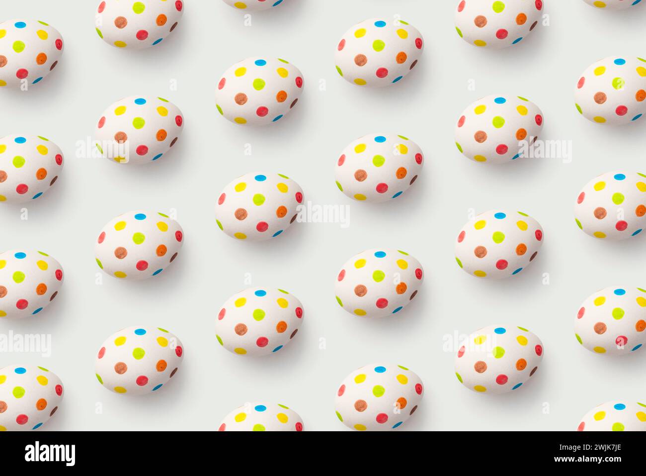 Hand painted colourful spotty easter eggs on white background. Directly ...