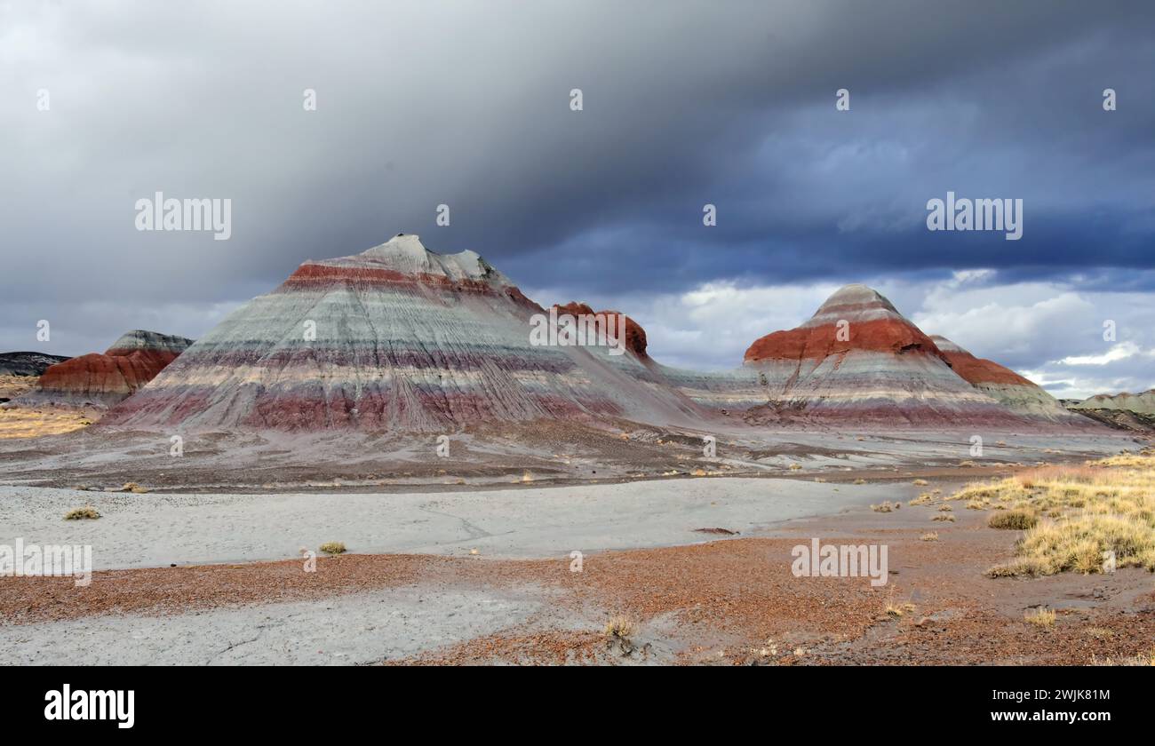 the colorful mudstone teepee rock formations on a stormy winter day in ...