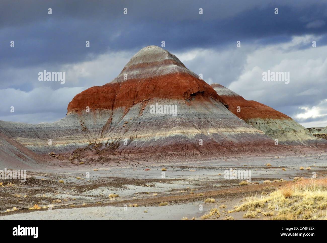 the colorful mudstone teepee rock formations on a stormy winter day in ...
