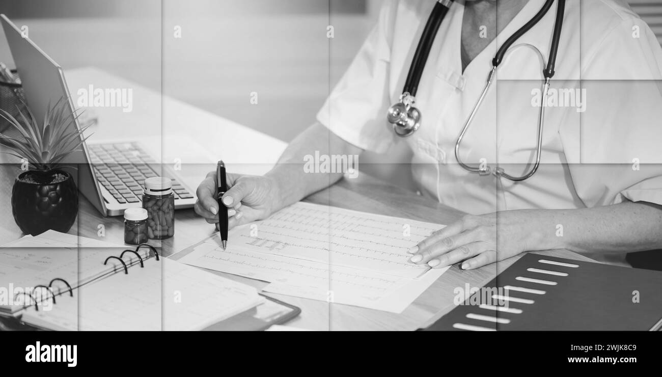 Female cardiologist examining an ecg graph in medical office, geometric ...