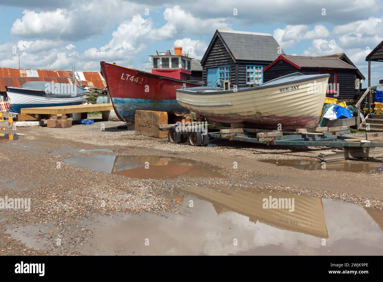 Fishing boats and huts at Southwold harbour, Suffolk, UK Stock Photo ...