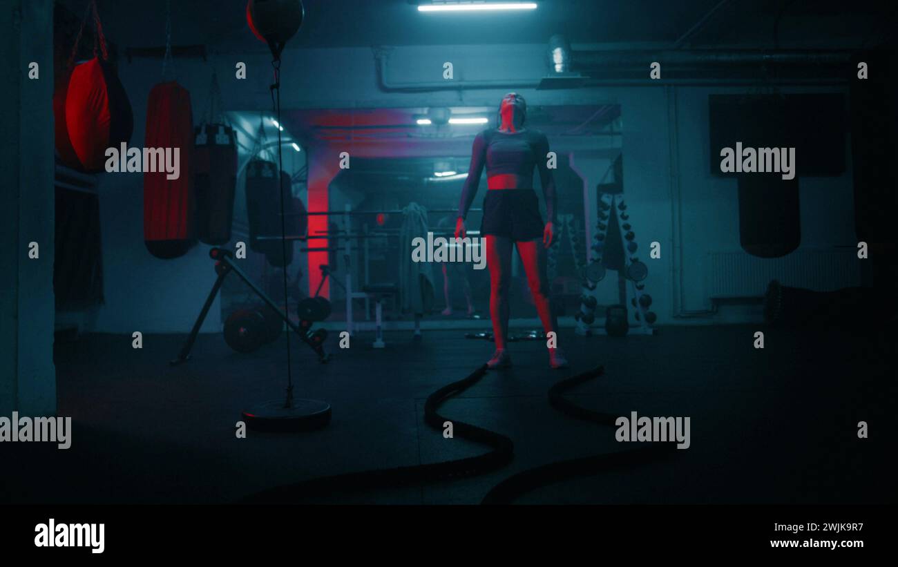 Professional female boxer does cardio or endurance workout before ...