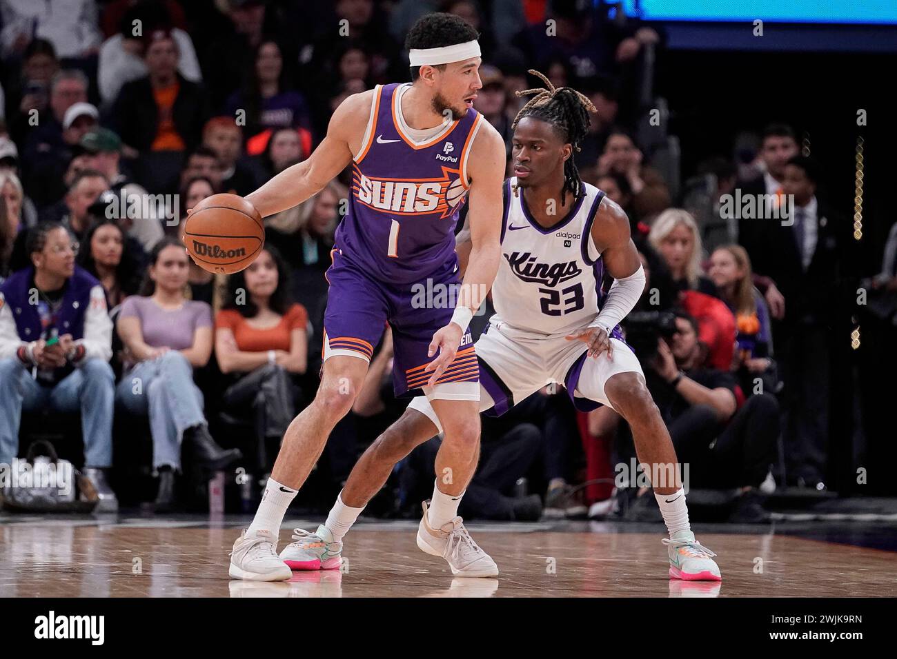 Phoenix Suns' Devin Booker (1) against the Sacramento Kings during the ...