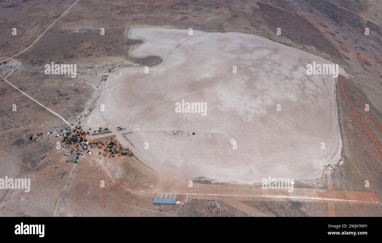 aerial landscape with airfield and lodge at big pan in Kalahari desert ...