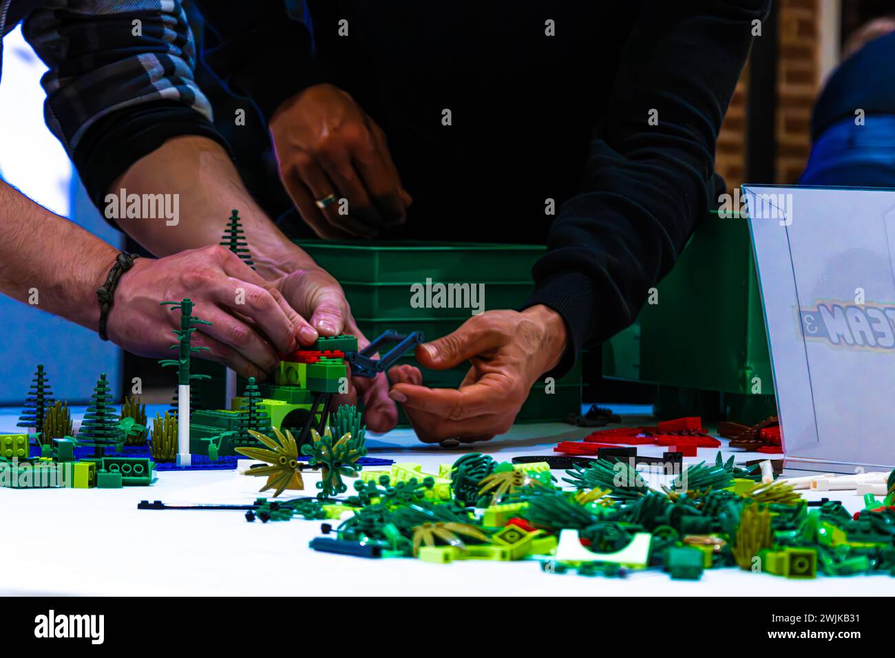 A Construction with lego gathering several people, teamwork Stock Photo ...