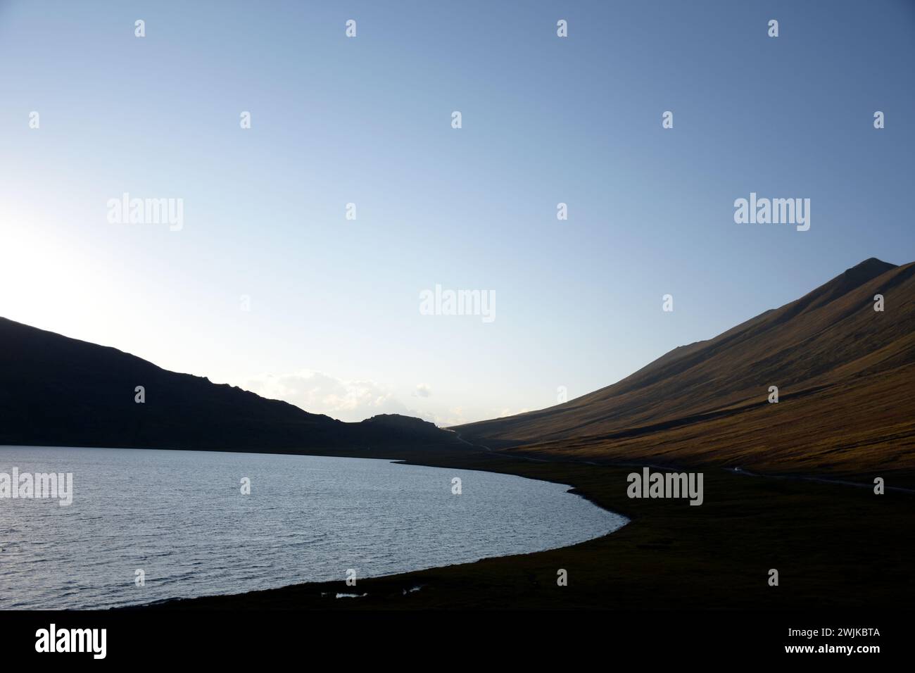 Lake Bank view with mountain landscape Stock Photo - Alamy